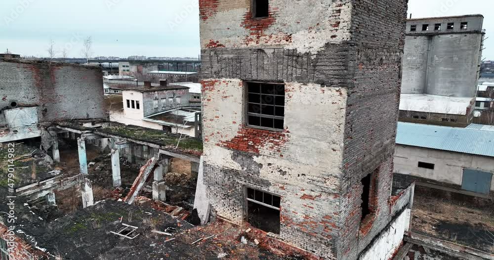 Bare brick walls and window holes in the bombed buildings. Ruined ...
