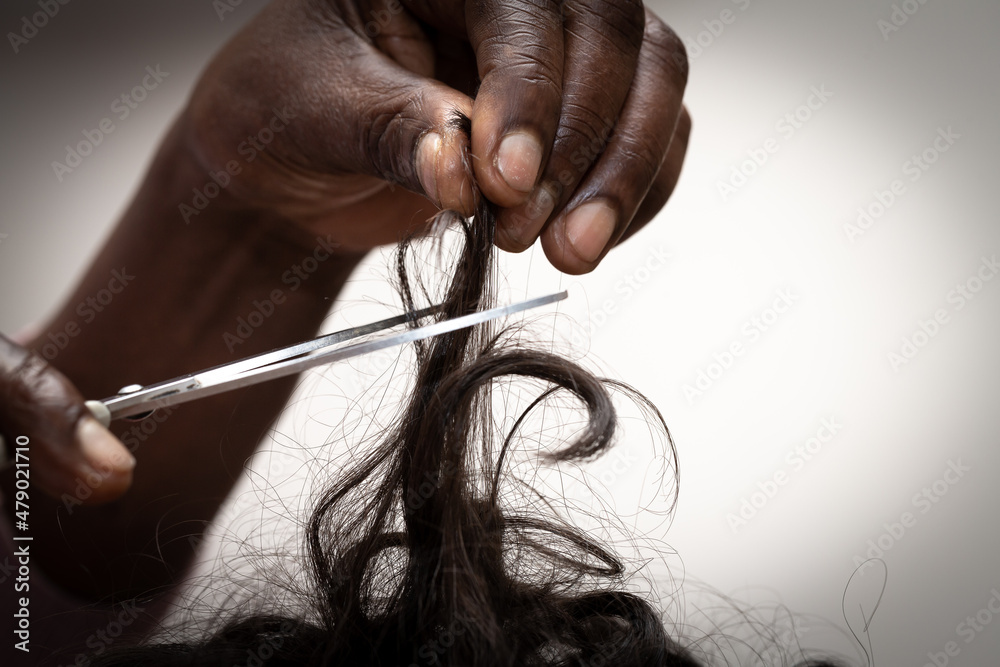 Cutting a lock of a child's hair for a witchcraft ritual. Concept of ...
