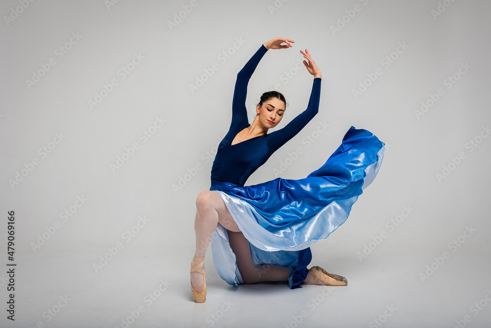 Modern ballet dancer exercising in full body on white studio background ...