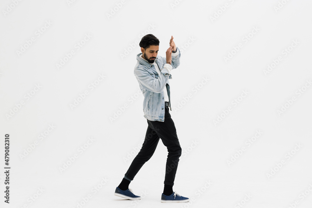 Young indian man standing scared over white studio background. Stock ...