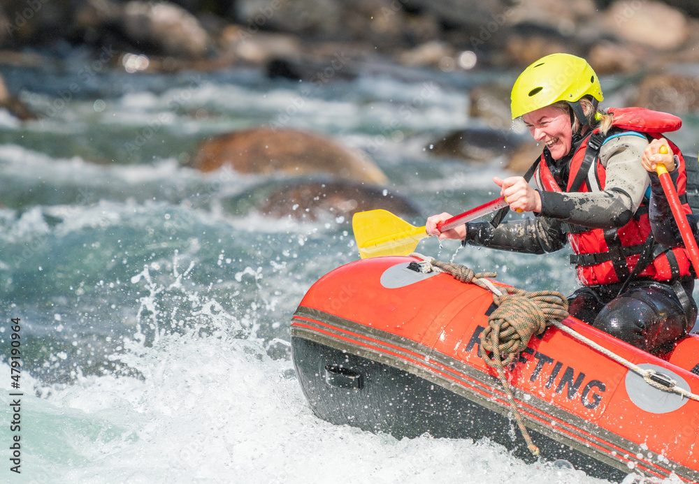 Two girls enjoying themself with river rafting water sports. Smiles ...