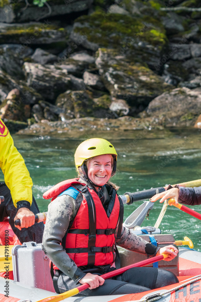 Two girls enjoying themself with river rafting water sports. Smiles ...