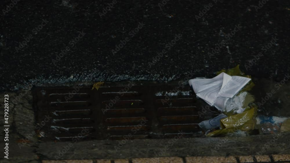 Rain falling on pavement Spring rain is falling and drops of water are ...
