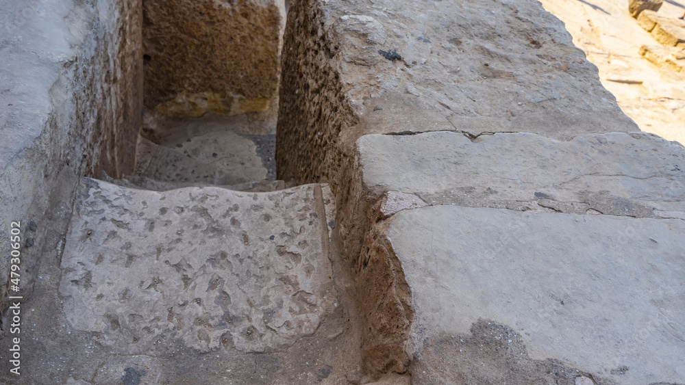 A staircase leads to the ancient Egyptian pyramid of Cheops. Rough ...