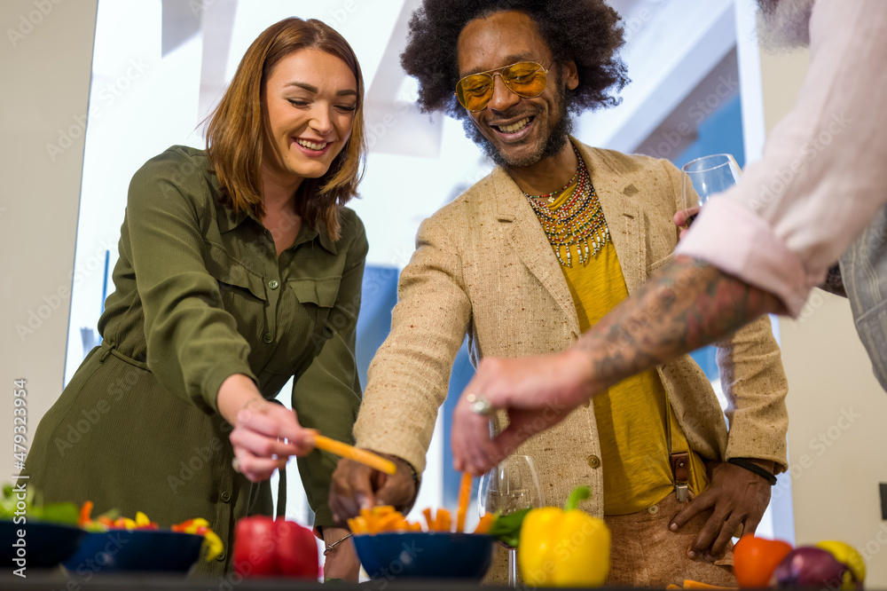 people eating vegan buffet, multiracial group of friends having fun at ...