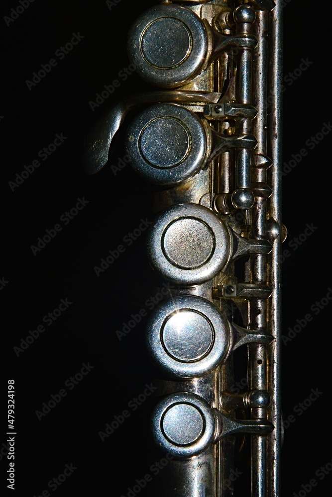Closeup detail of keys on central part of transverse flute (this part ...