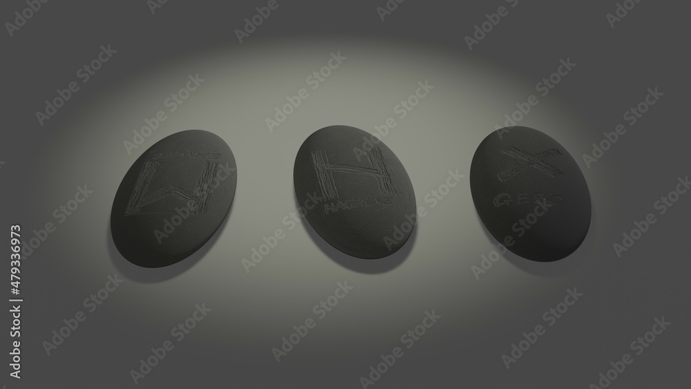 Three scandinavian oval runes made of stone devination, placed over ...