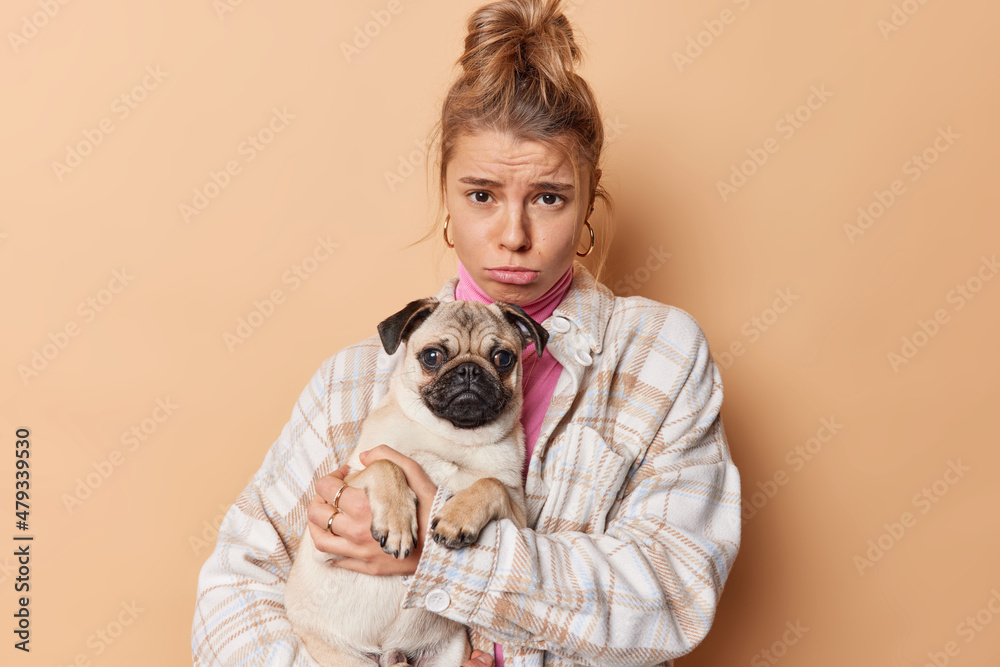 Disappointed frustrated young female pet owner sad because of illness ...