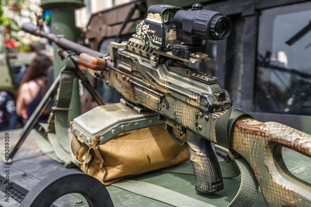 Machine gun Kalashnikov on the tripod and optical sight.M249 light ...