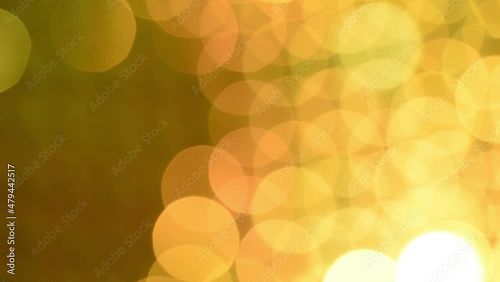 Looped movement of golden yellow bokeh from left to right. HD Loop ...