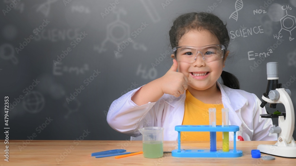 Asian child girl learning science chemistry with test tube making ...