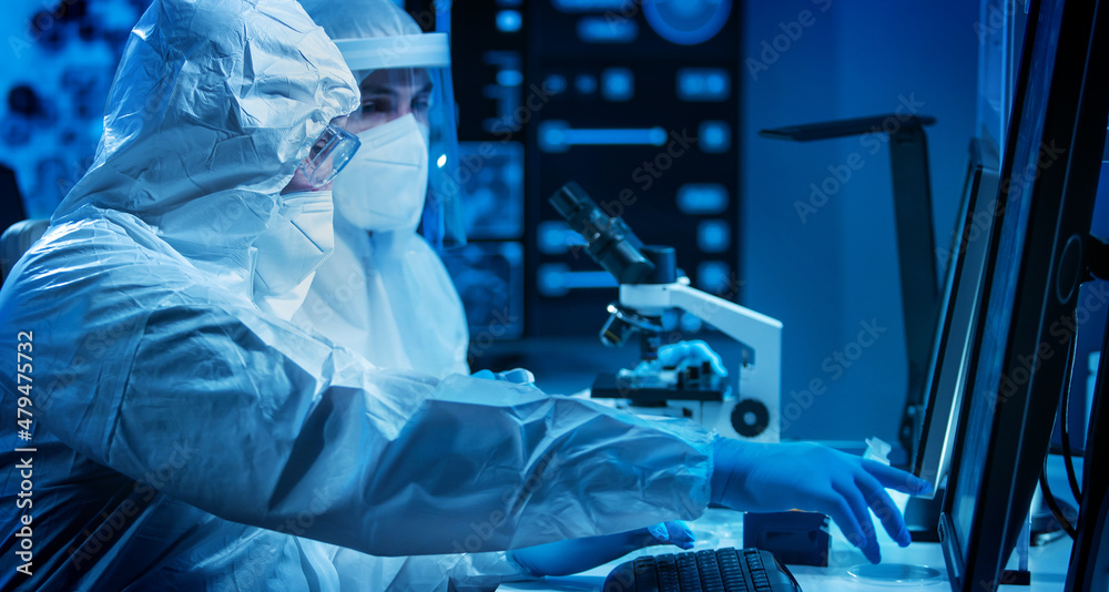 Scientists work in a modern scientific lab using laboratory equipment ...