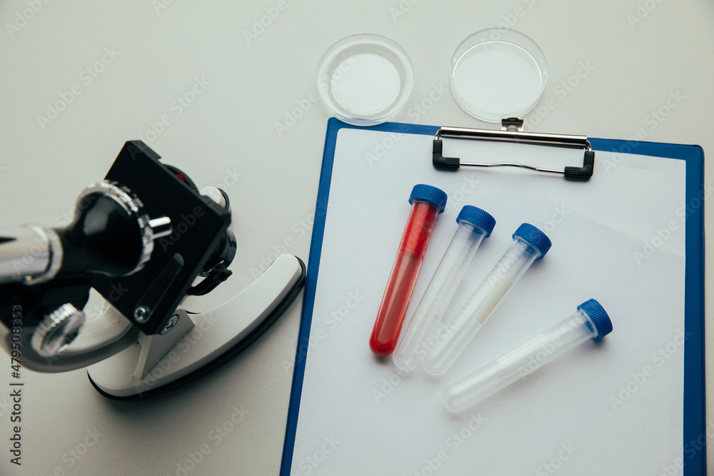 Laboratory test concept. Microscope and test tube on a table Stock ...