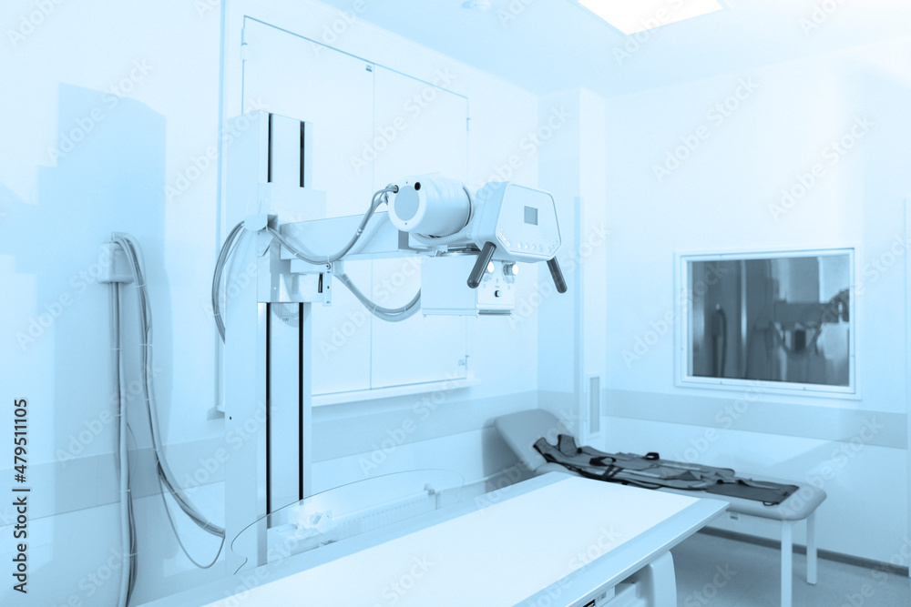 X-ray department in modern hospital. Radiology room with scan machine ...