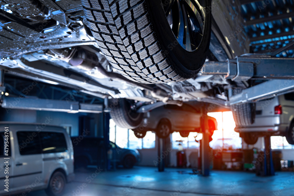 Auto service interior background with cars on the lift. Stock Photo ...