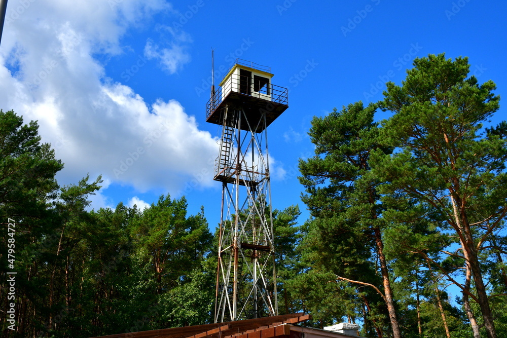 A view of a tall metal observation tower located next to the Polish ...