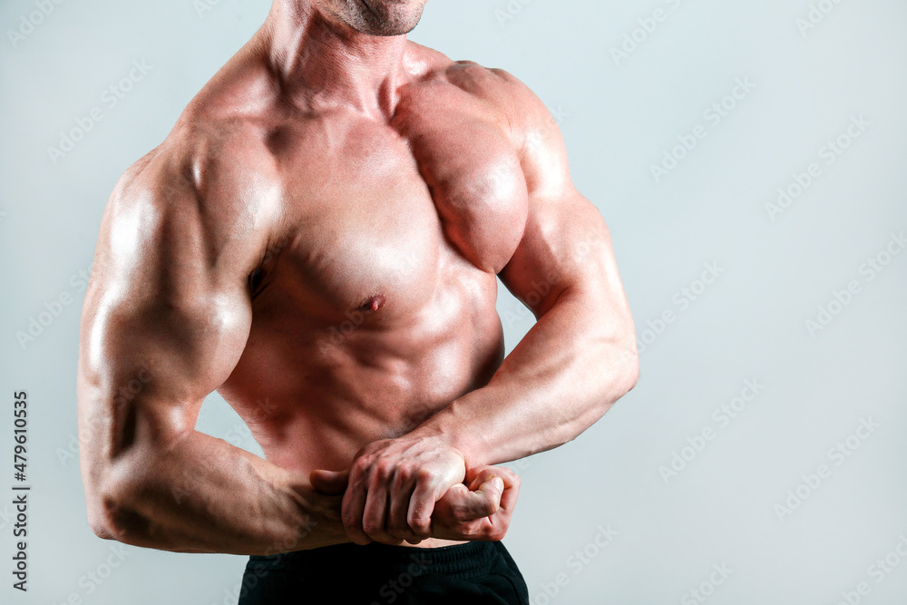 Professional bodybuilder posing over isolated white background. Studio ...