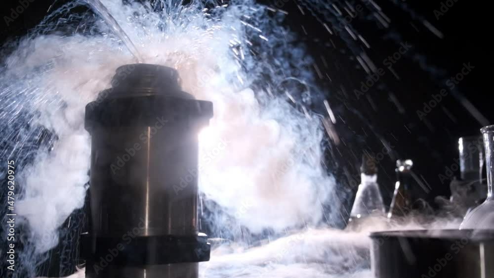 Liquid nitrogen is poured into a thermos. Steam is spreading. Chemical ...