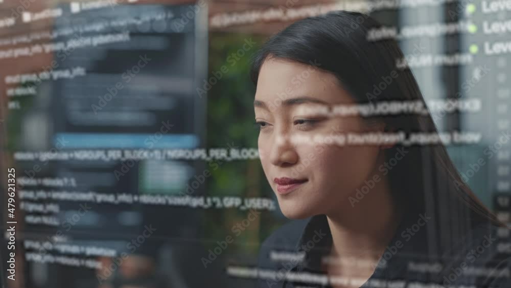 Portrait of focused asian software developer through vfx of floating ... Portrait of focused asian software developer through vfx of floating ...