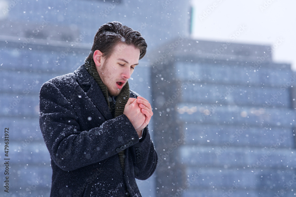 Portrait of frozen handsome guy in formal coat, young handsome freezing ...
