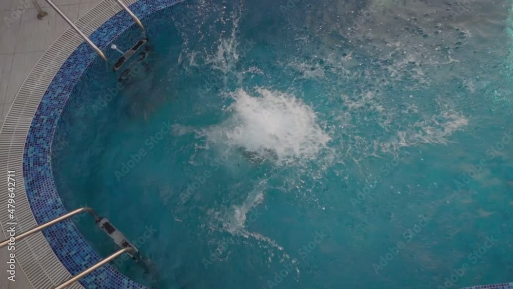 boy jumps into pool top view. Jump into water in swimming pool, Splash ...