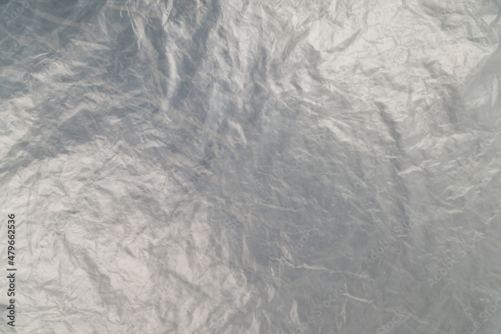 full frame background of flat crumpled semi-transparent polyethylene ...
