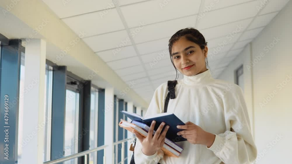 Pakistani woman student with a books in the university or college. New ...