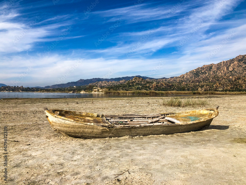 Drought lake and old fishing boat. Old boat on the drought lake ...