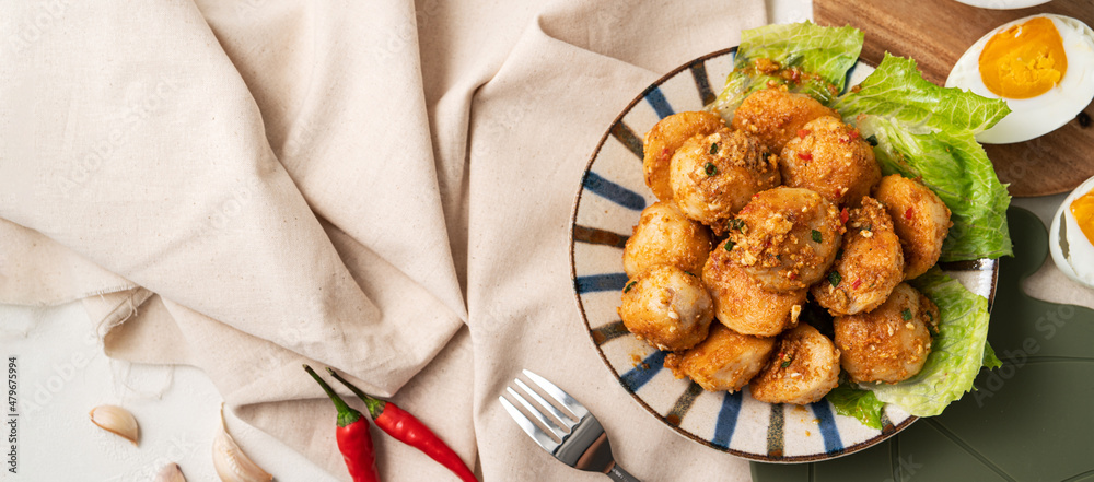 Deep fried cuttlefish ball with salted egg yolk coating Stock Photo ...