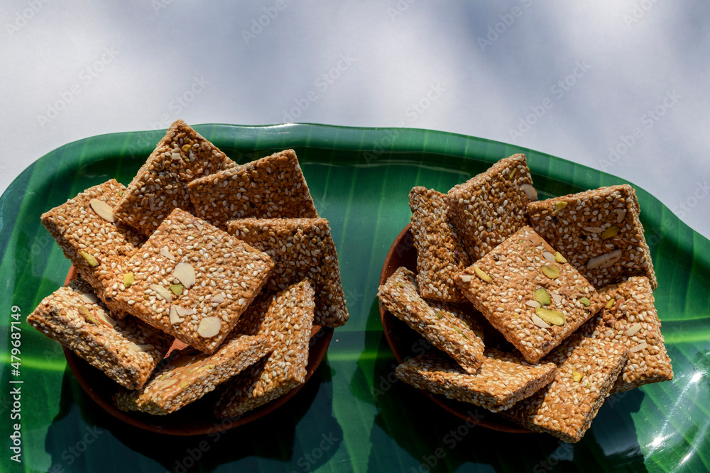 Badam Pista Gur Patti Gajak . It is made of jaggery and sesame slabs ...