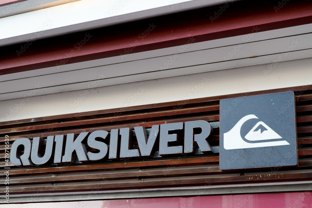 Quiksilver sign text and brand logo front of wall store fashion on ...