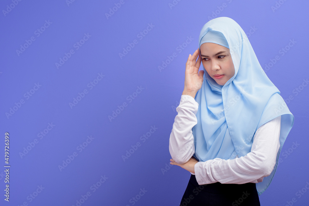 Young muslim woman wearing hijab stressed and tired over blue ...