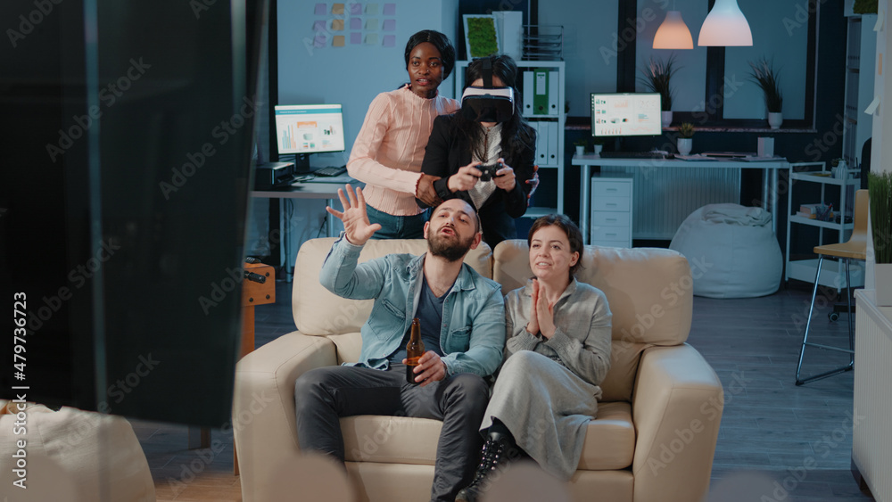 Foto Stock Workmates playing video games on television to have fun ...