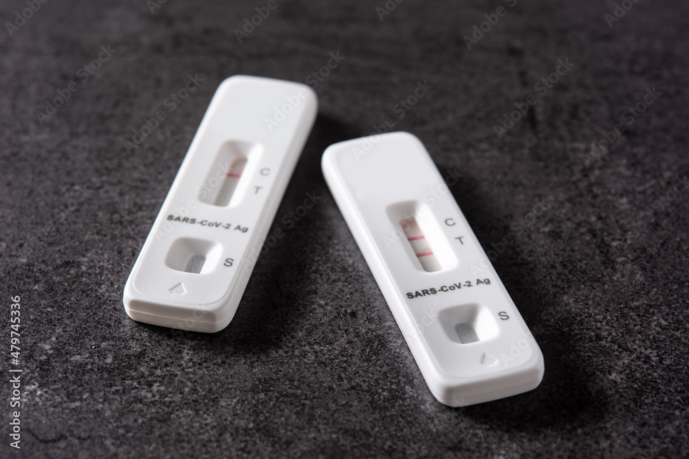 Covid-19 rapid antigen test on black background Stock Photo | Adobe Stock