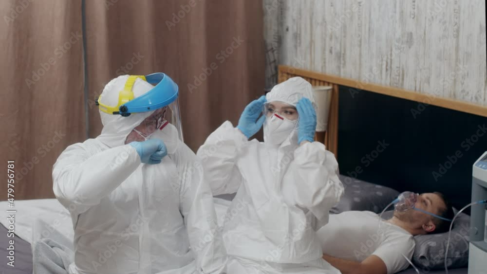 Doctors give resuscitation to a male patient lying with oxygen ...