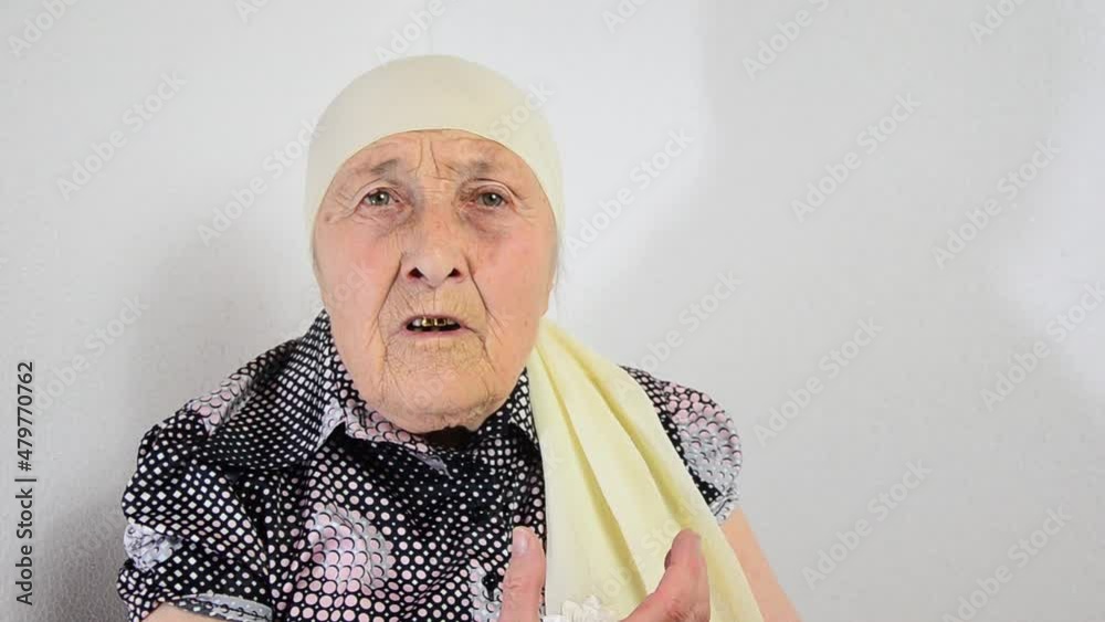 The wrinkled face of an old grandmother. Grandmother's face close up ...