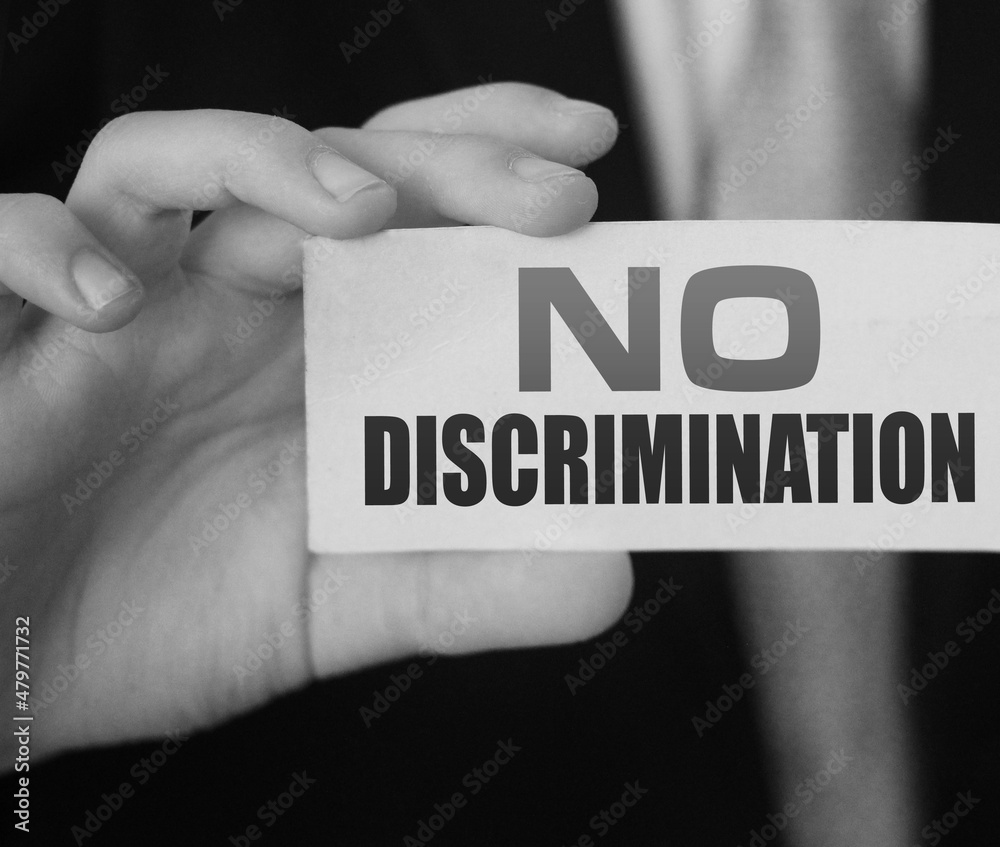 No discrimination words on a card in businessman hand. Social concept ...