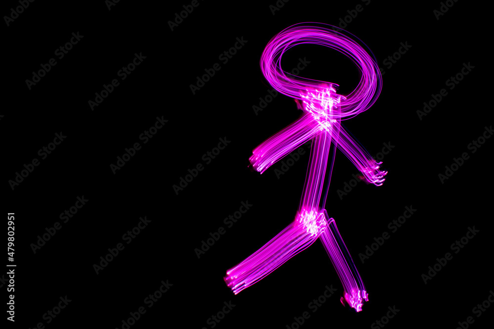 Neon stickman against black background. Light painting pink stickman ...