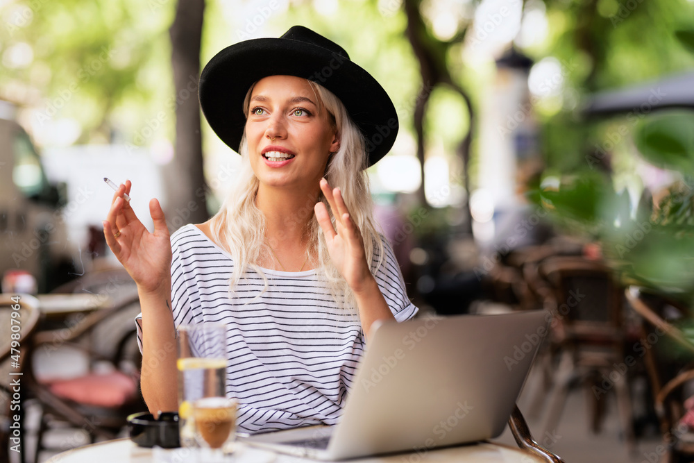 French style woman smoking cigarette at outdoor cafe Stock Photo ...