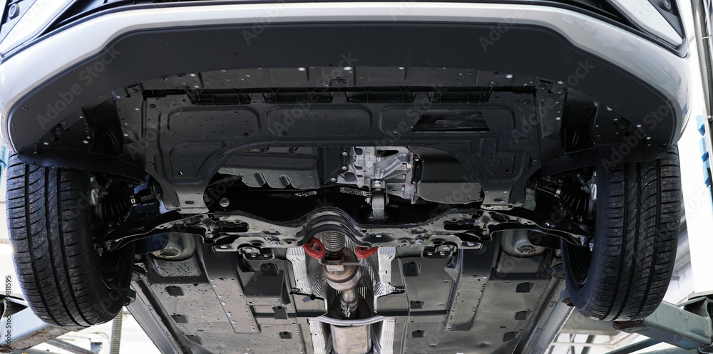 Foto de Modern car in a car service on a lift. The front of the car is ...