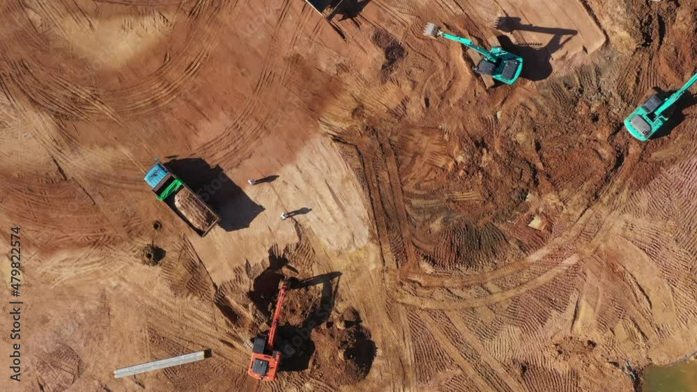Construction site, Aerial top view road roller and loader excavator ...