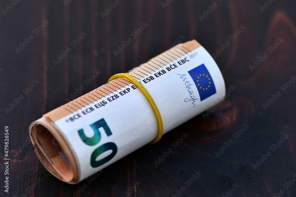 Roll of 1000 Euro in 50 Euro banknotes. Stack of money of Europe. Bunch ...