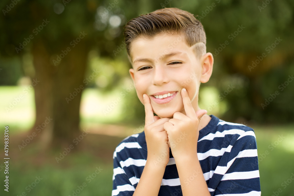 Happy beautiful Caucasian little kid boy wearing stripped T-shirt ...