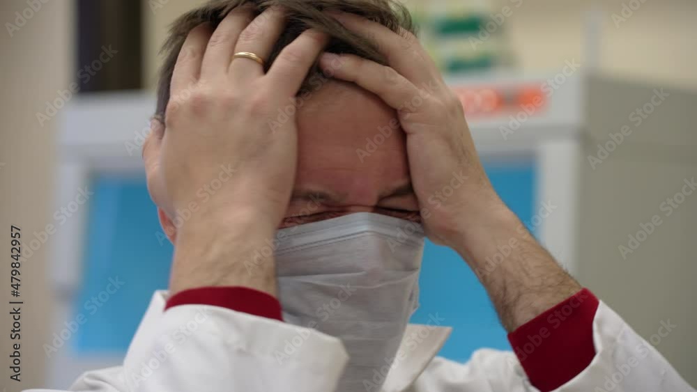 Millennial guy suffering migraine headache problem holding head with ...