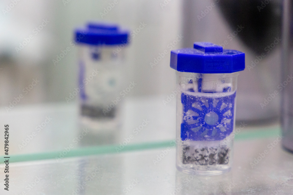 Eye lens equipment: container, eye drops, lenses and liquid Stock Photo ...