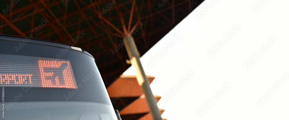 Airport Shuttle Bus with led destination sign is parked under station ...
