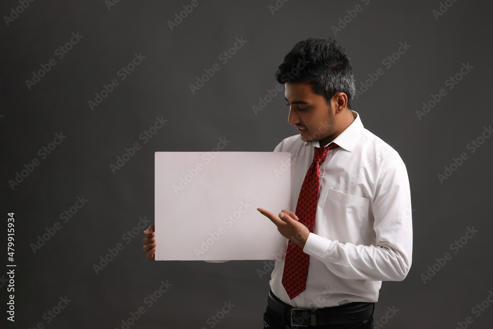 Young indian business man holding blank sign board. Stock Photo | Adobe ...