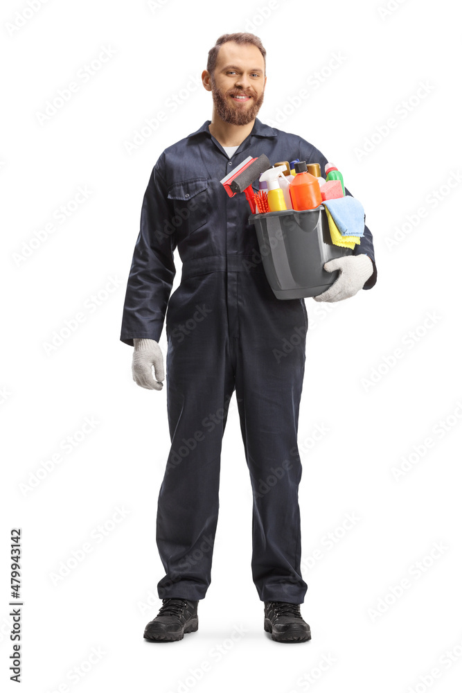 Full length portrait of a male cleaner in a uniform holding a bucket of ...