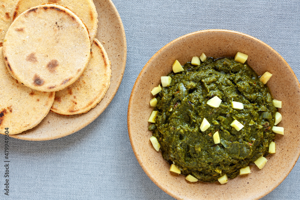 Mustard greens dish with corn roti flatbreads. Vegan Indian meal (Makki ...