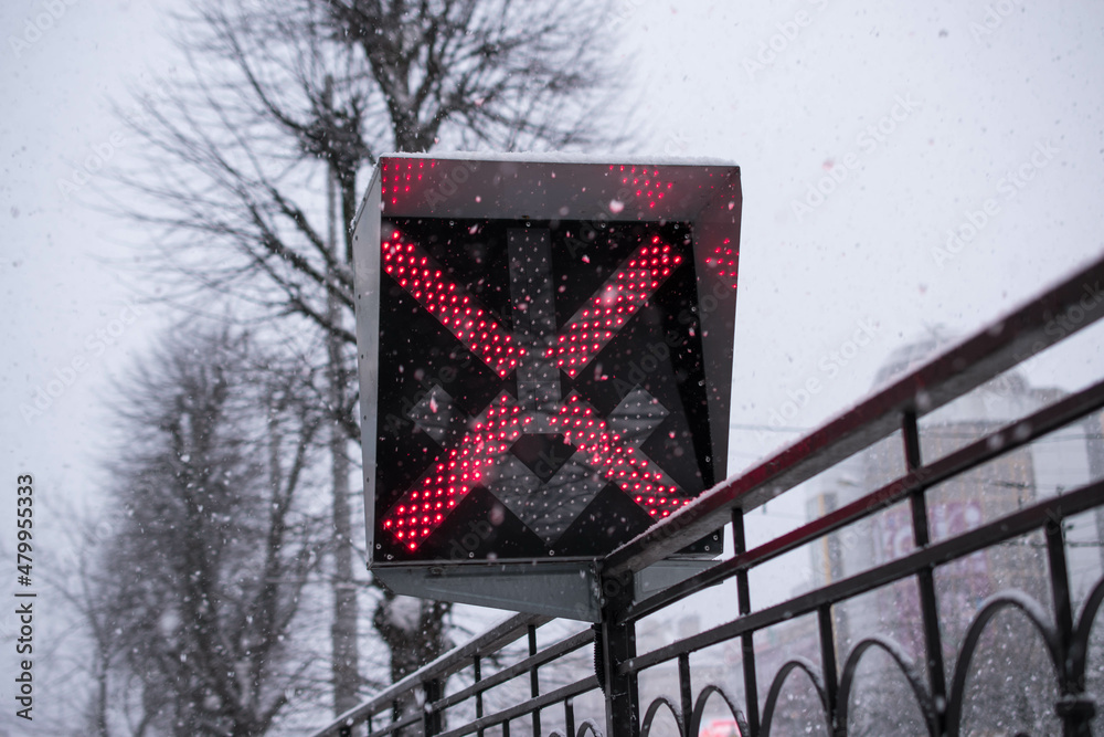 Red parking traffic light. No entry sign. Traffic light on a snowy ...